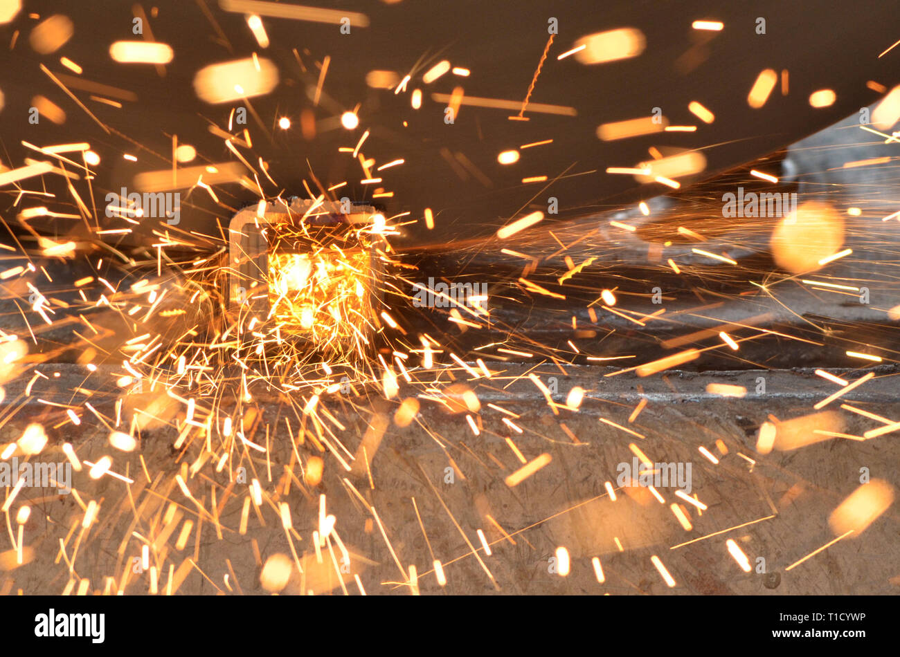 Spark stream of cutter machine cutting iron pipe, spark light ...