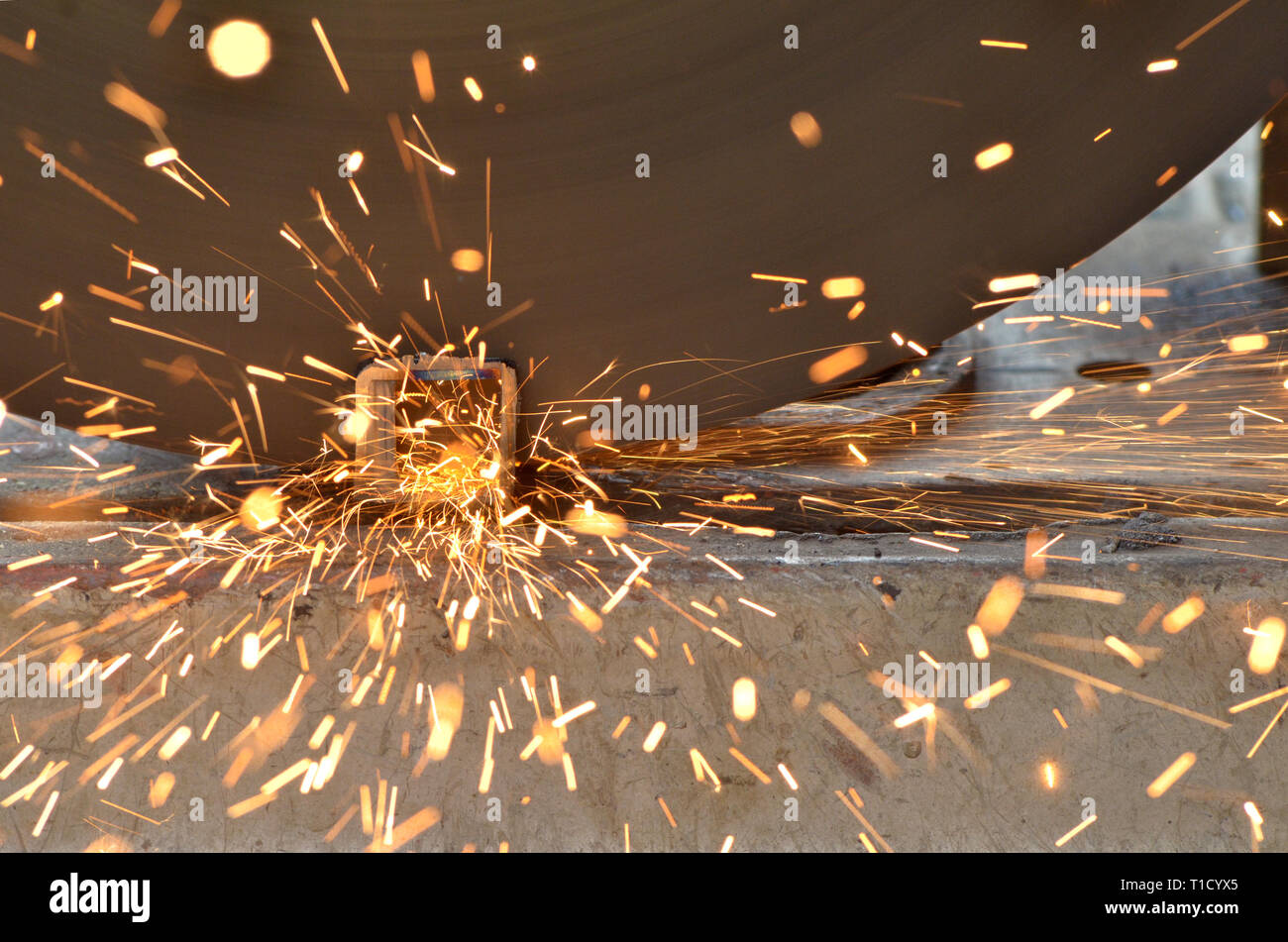 Spark stream of cutter machine cutting iron pipe, spark light ...