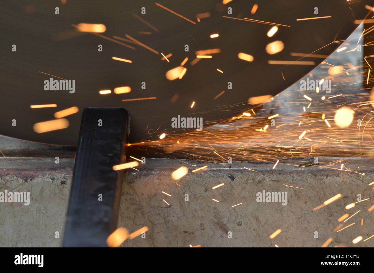 Spark stream of cutter machine cutting iron pipe, spark light ...