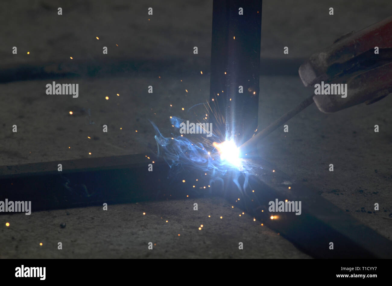 Spark from weld work when welder welding iron, steel structure in ...