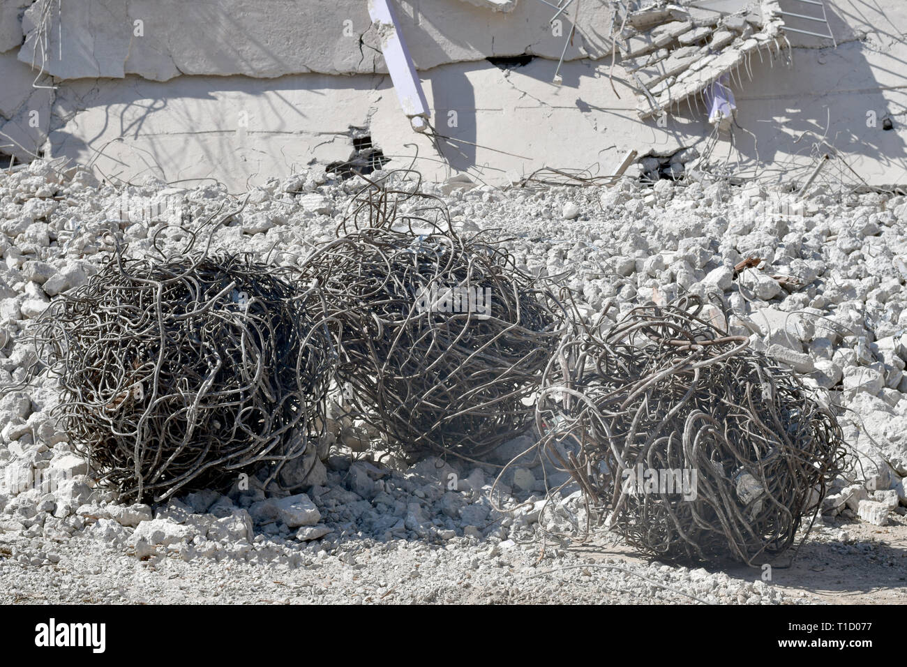 Steel bar that compressed as ball after demolished a building, iron ...