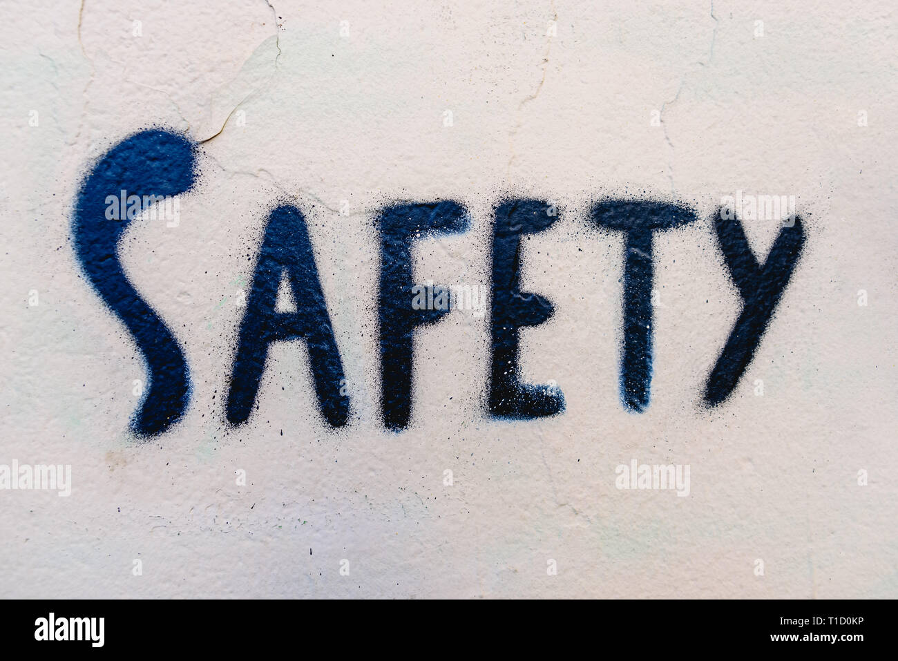 Safety word written with black paint on a wall Stock Photo - Alamy