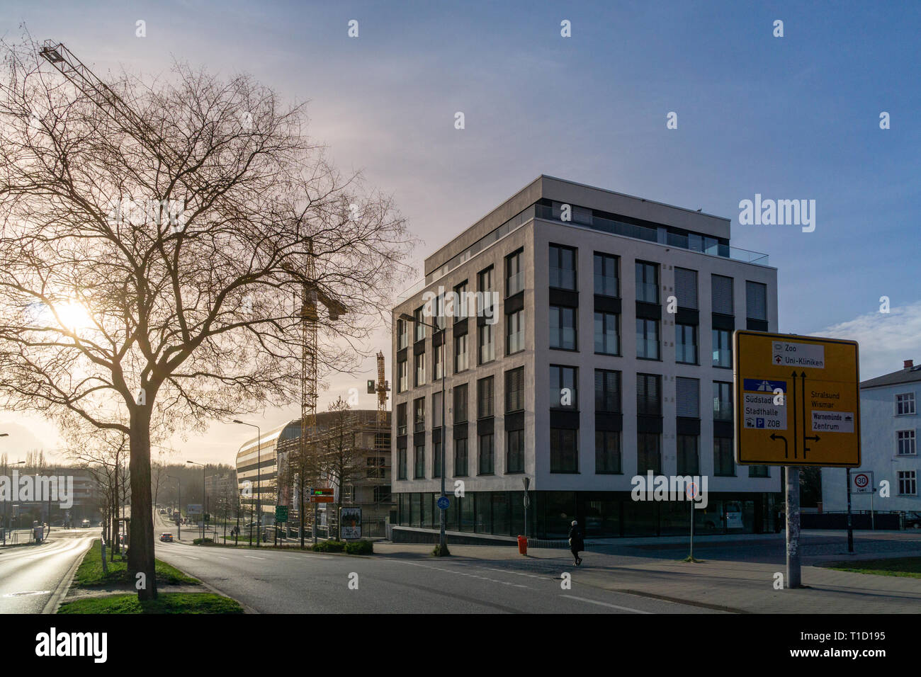 street view - modern house and construction side Stock Photo - Alamy