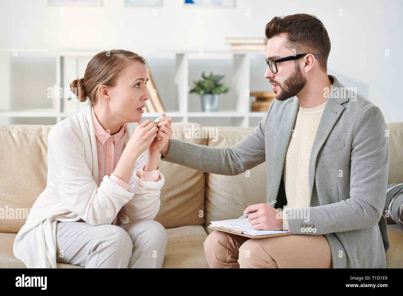 Consultation on couch Stock Photo - Alamy