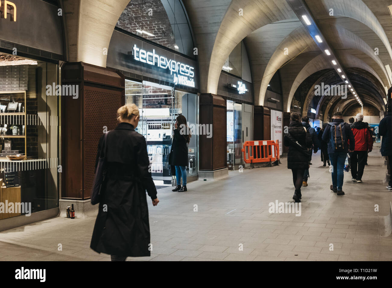 London, UK - March 16, 2019: People walking past the shops inside ...