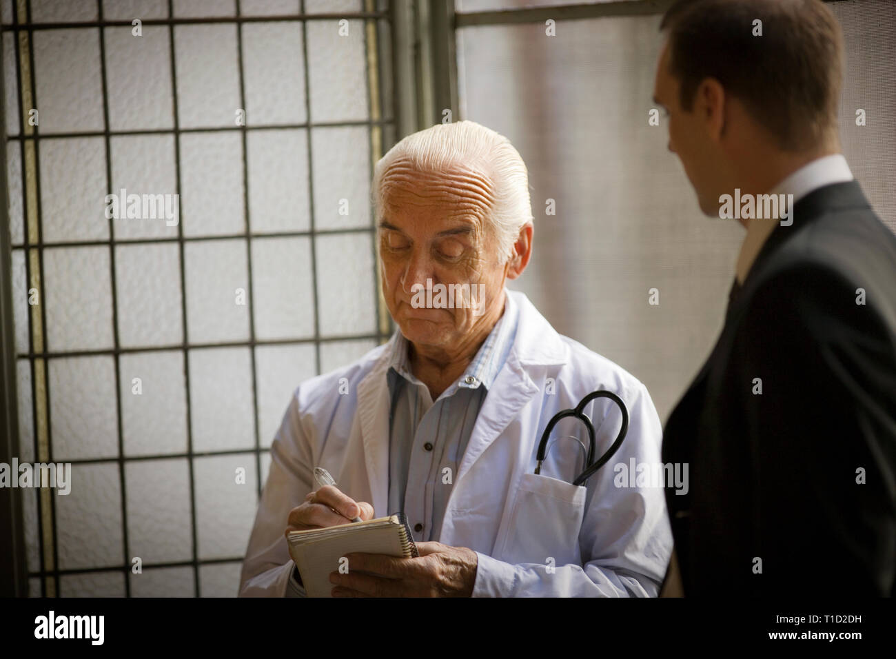 Caucasian male doctor writing hi-res stock photography and images - Alamy