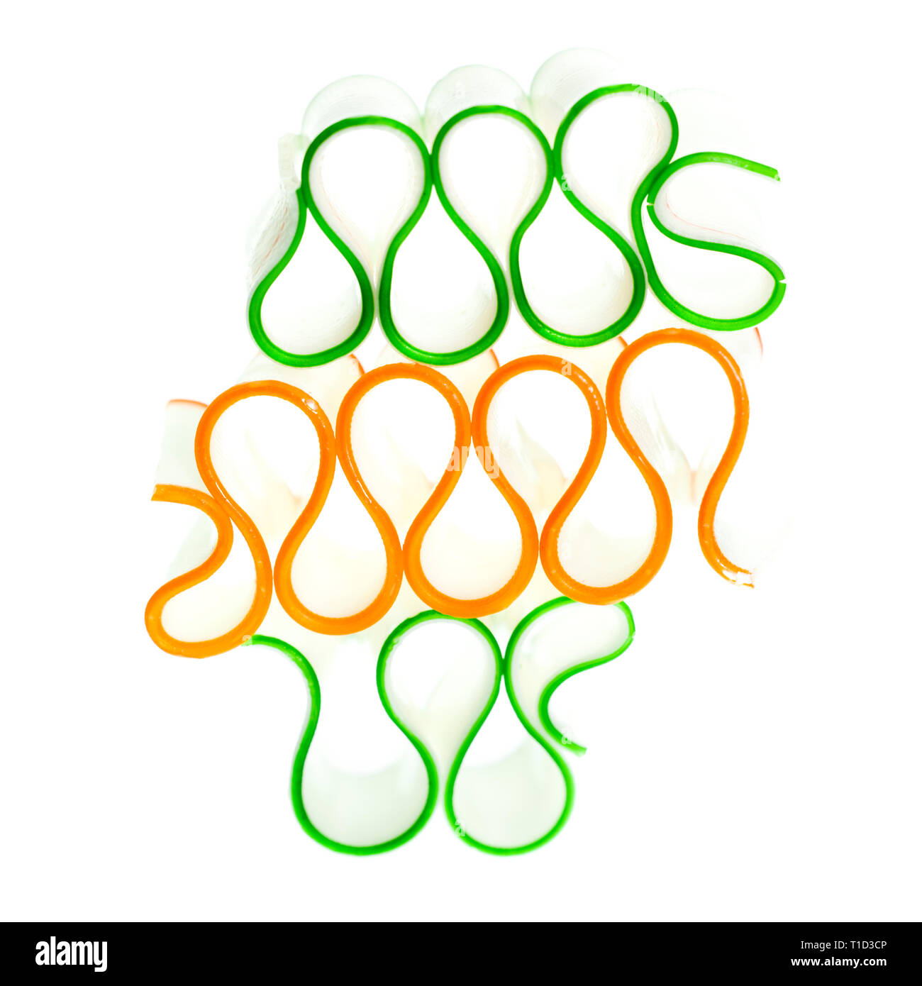 Green and Orange Ribbon Candy against White Background Stock Photo - Alamy