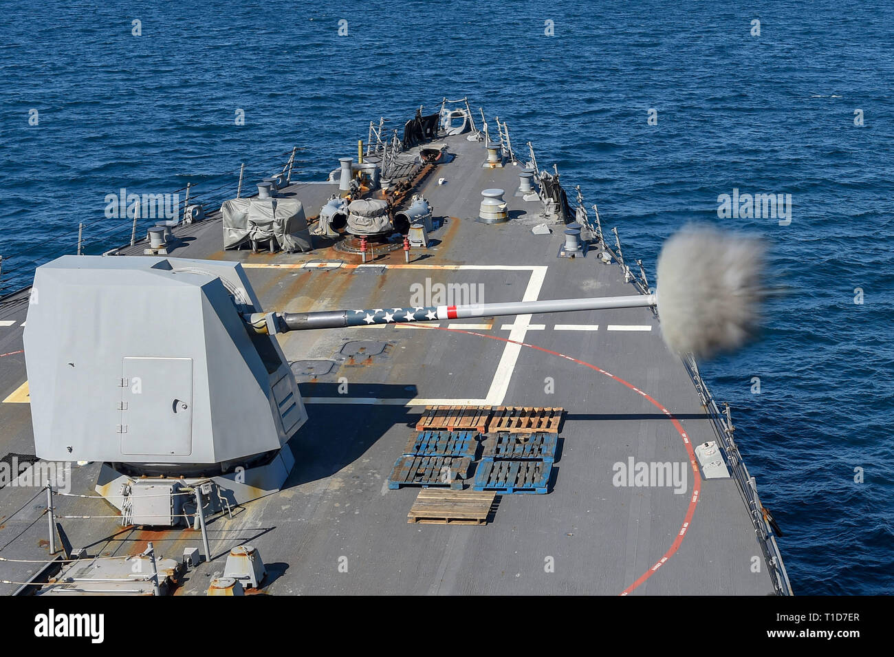 The guided-missile destroyer USS Gravely (DDG 107) fires its 5-inch gun ...