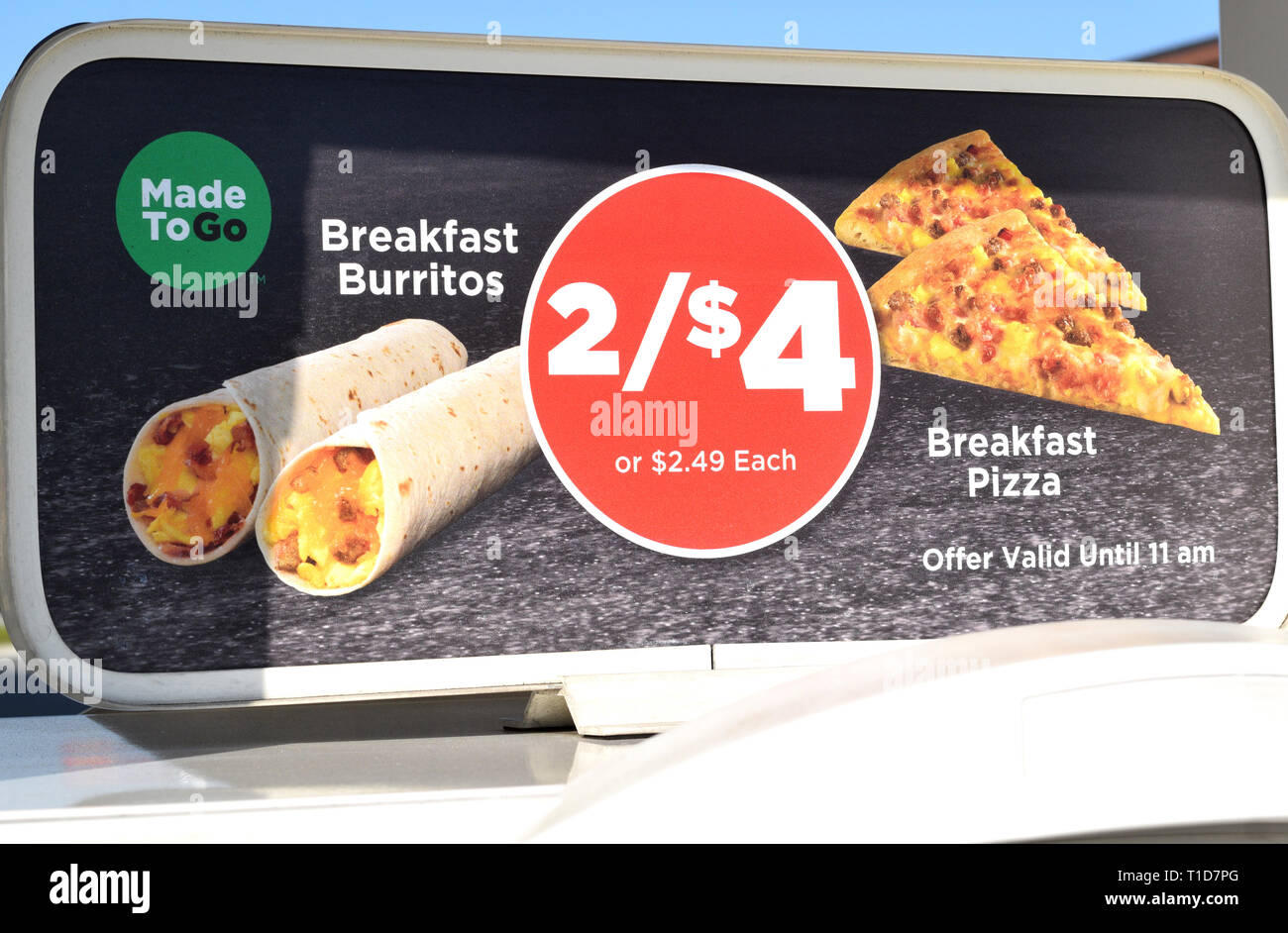 Breakfast burrito and pizza advertisement sign Stock Photo - Alamy