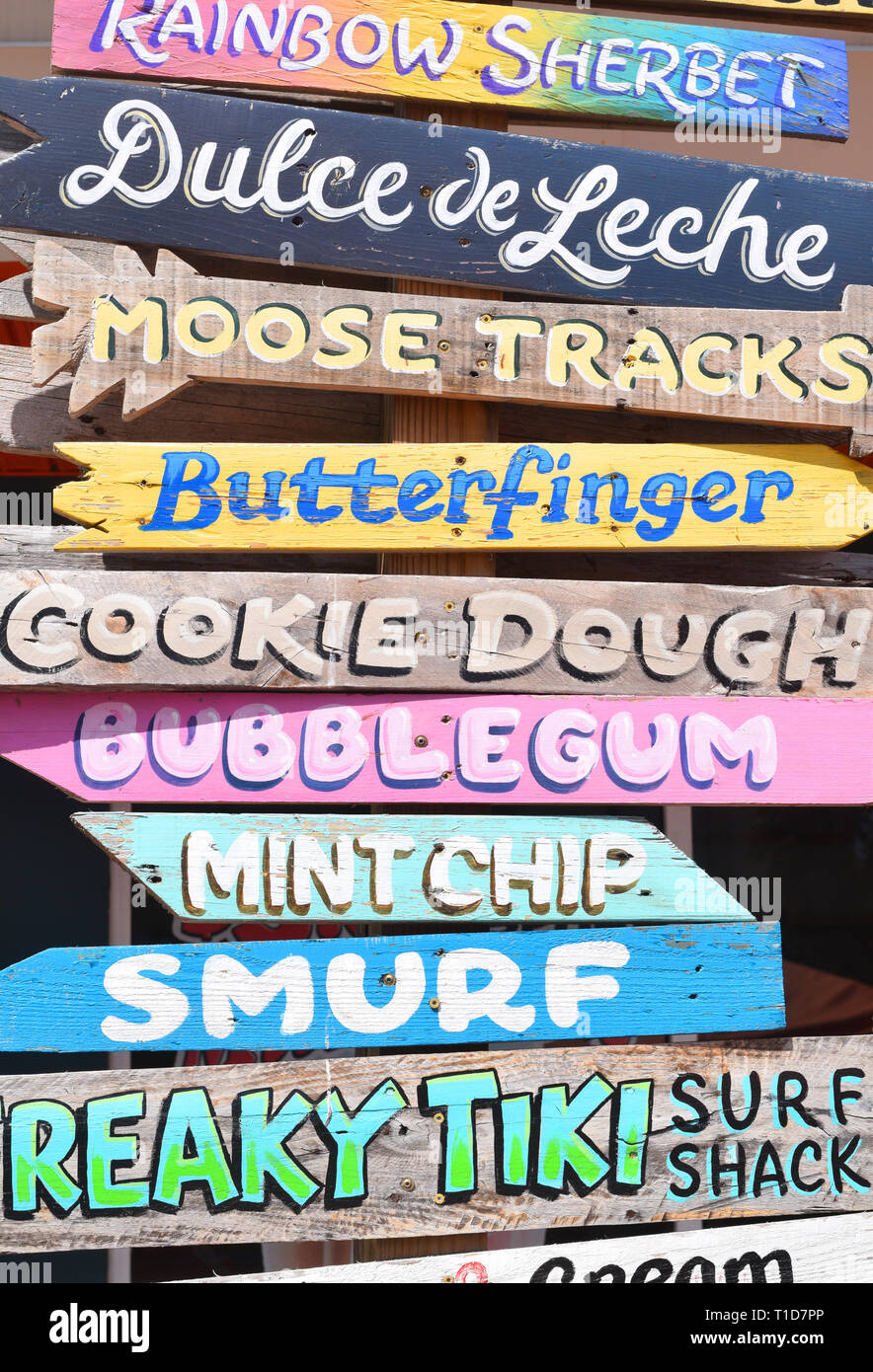 Wooden outdoor sign featuring various unique ice cream flavors Stock ...