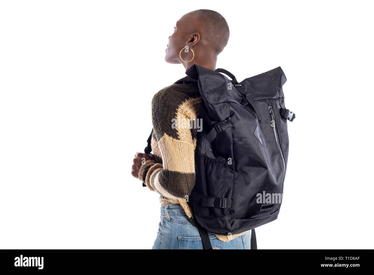 Black African American female wearing a backpack looking at white ...