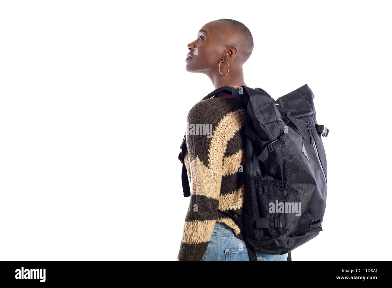 Black African American female wearing a backpack looking at white ...