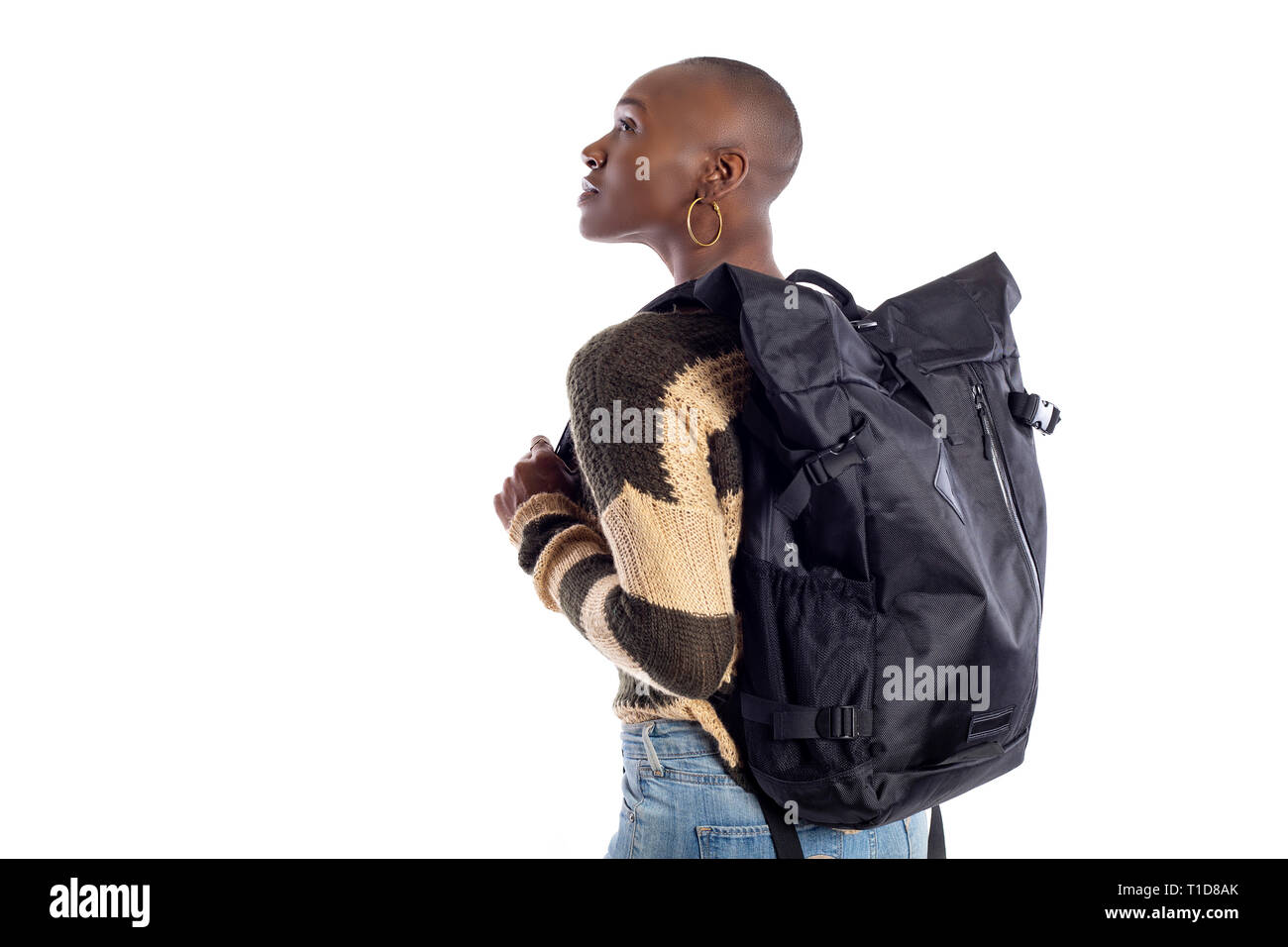 Black African American female wearing a backpack looking at white ...