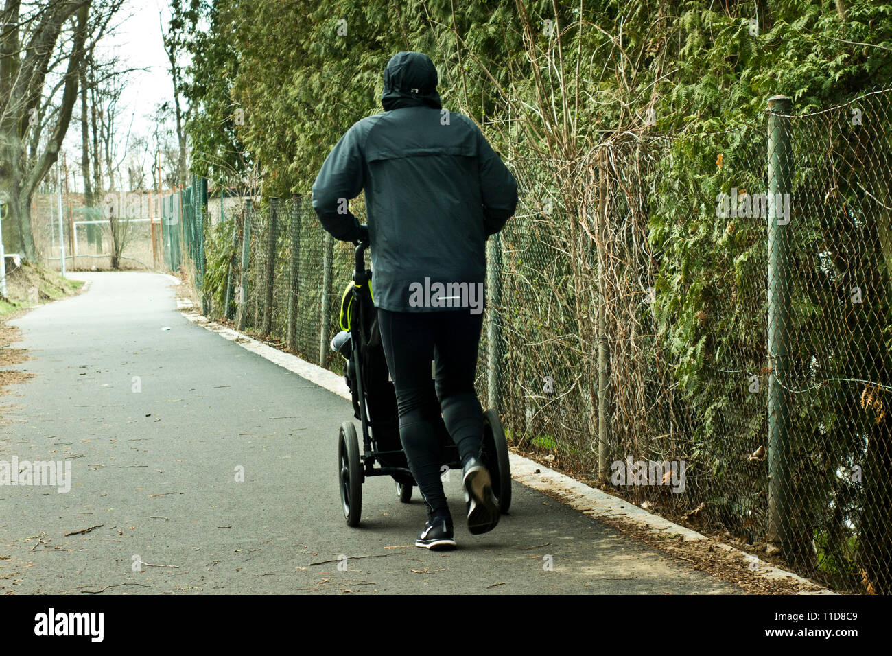 father doing jogging with a stroller Stock Photo - Alamy