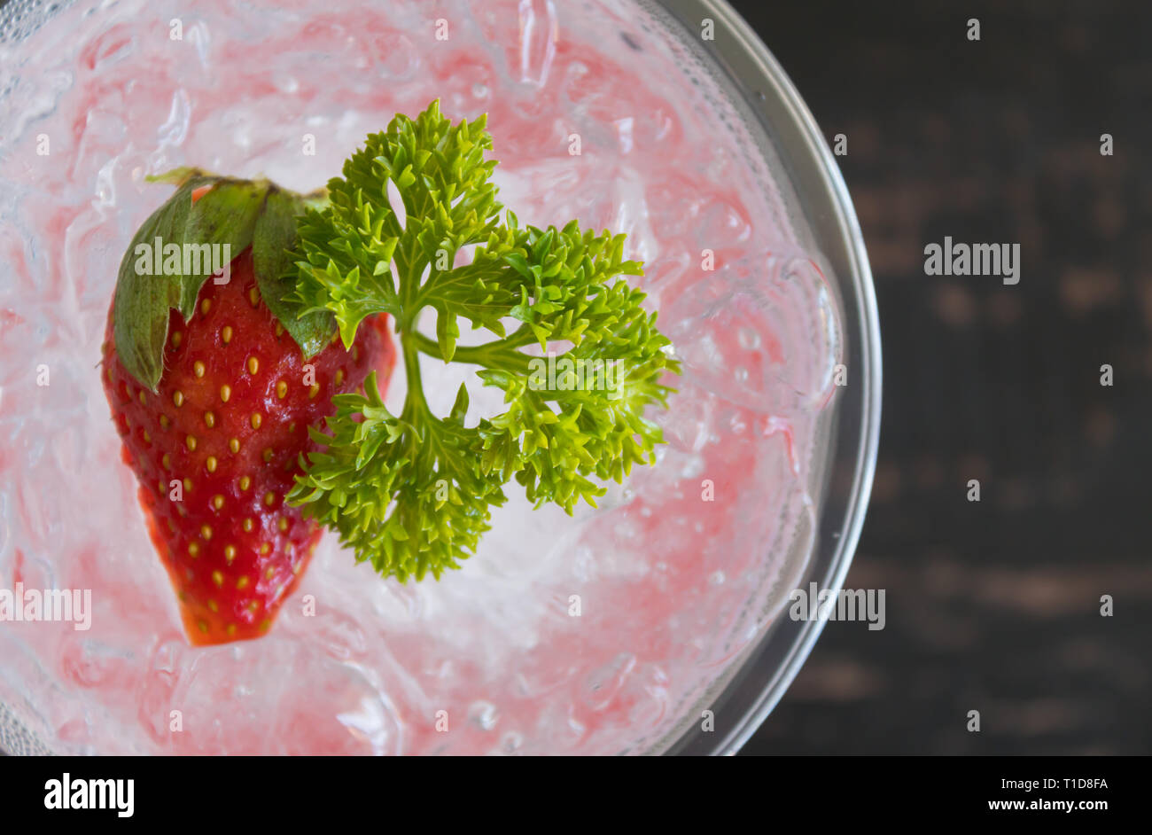 Red Italian Soda Cold Beverage and Strawberry Fruit and Parsley. Red ...