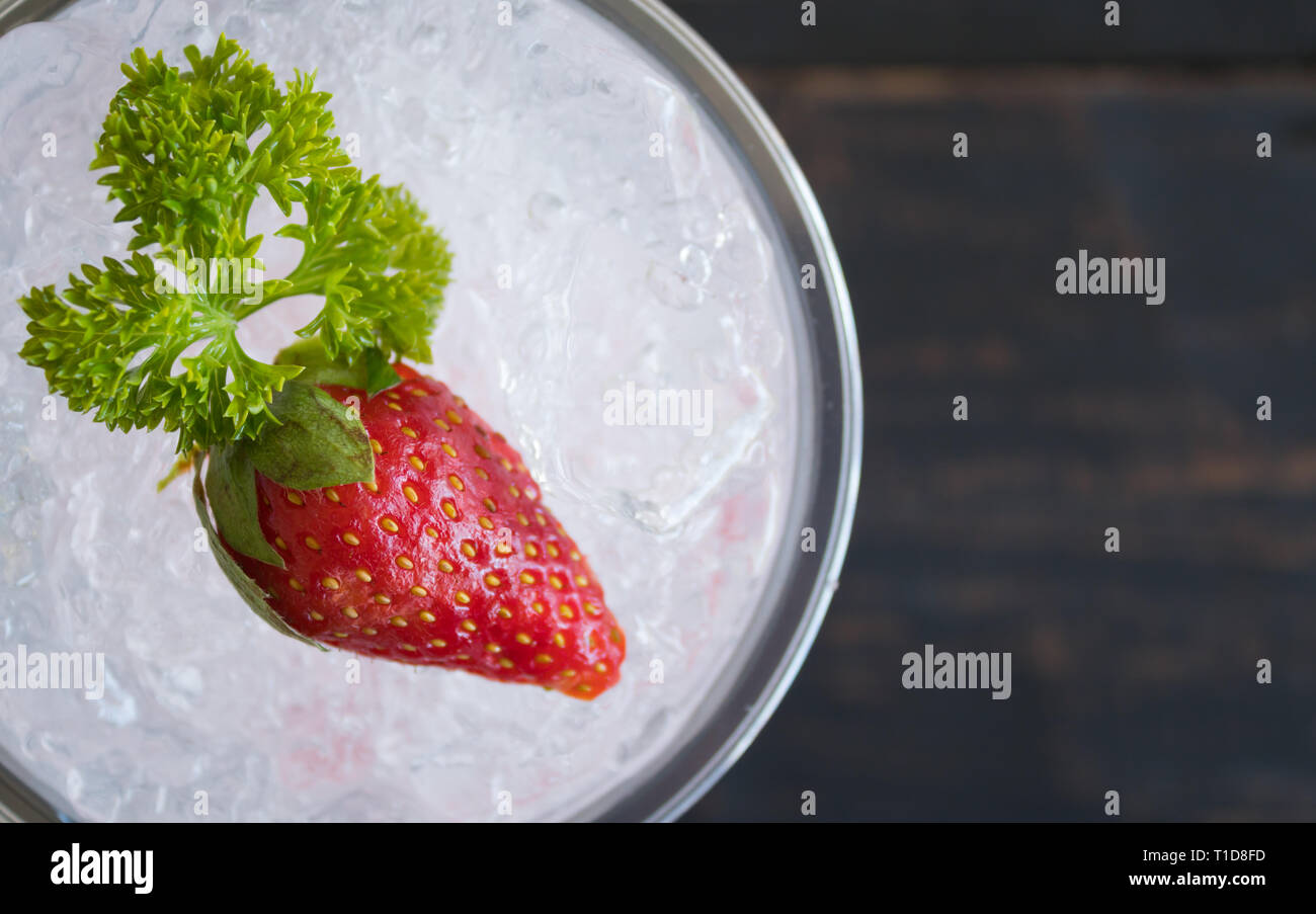 Red Italian Soda Cold Beverage and Strawberry Fruit and Parsley. Red ...