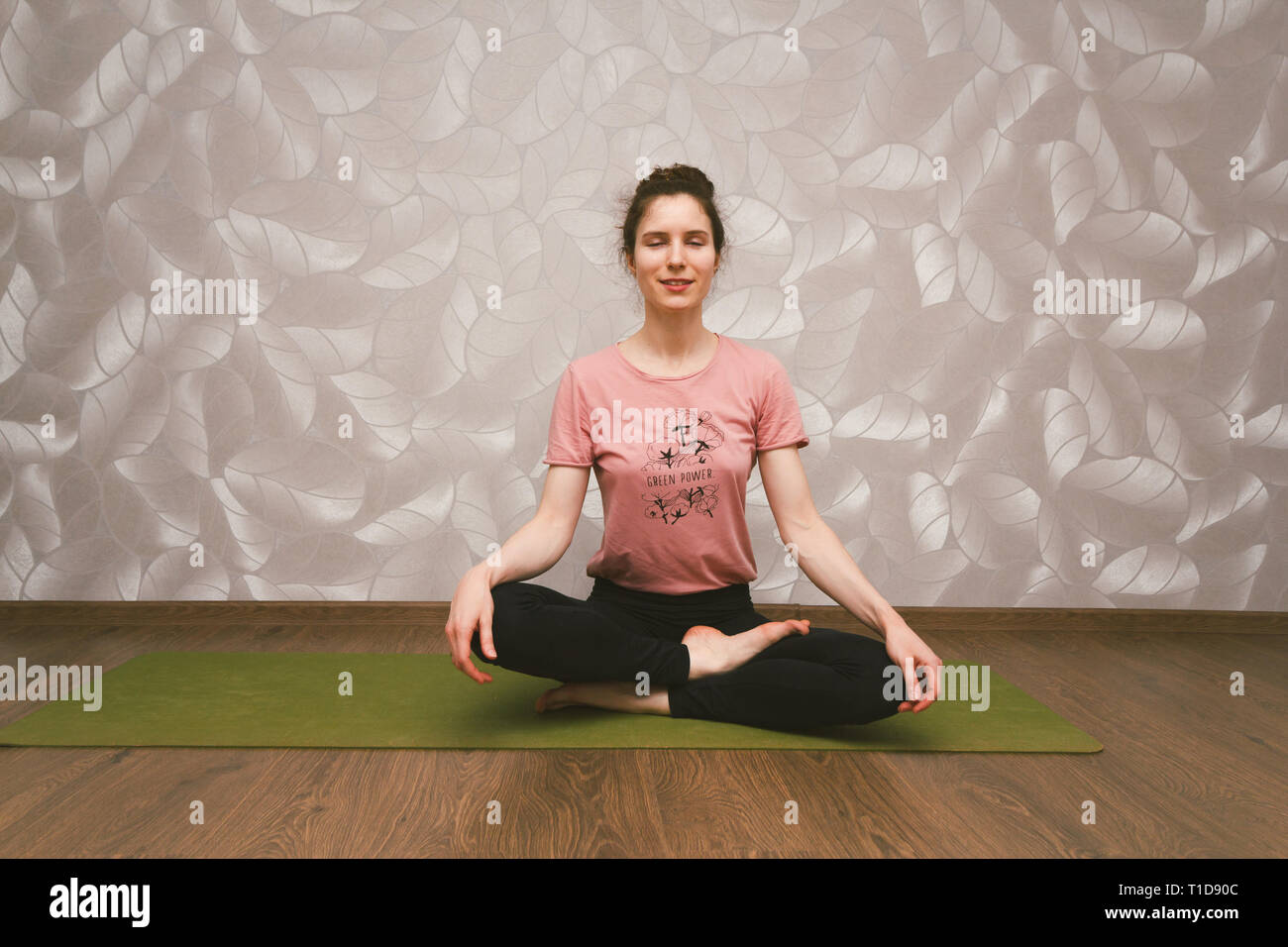 beautiful woman sitting in lotus position, home yoga practise, healthy ...
