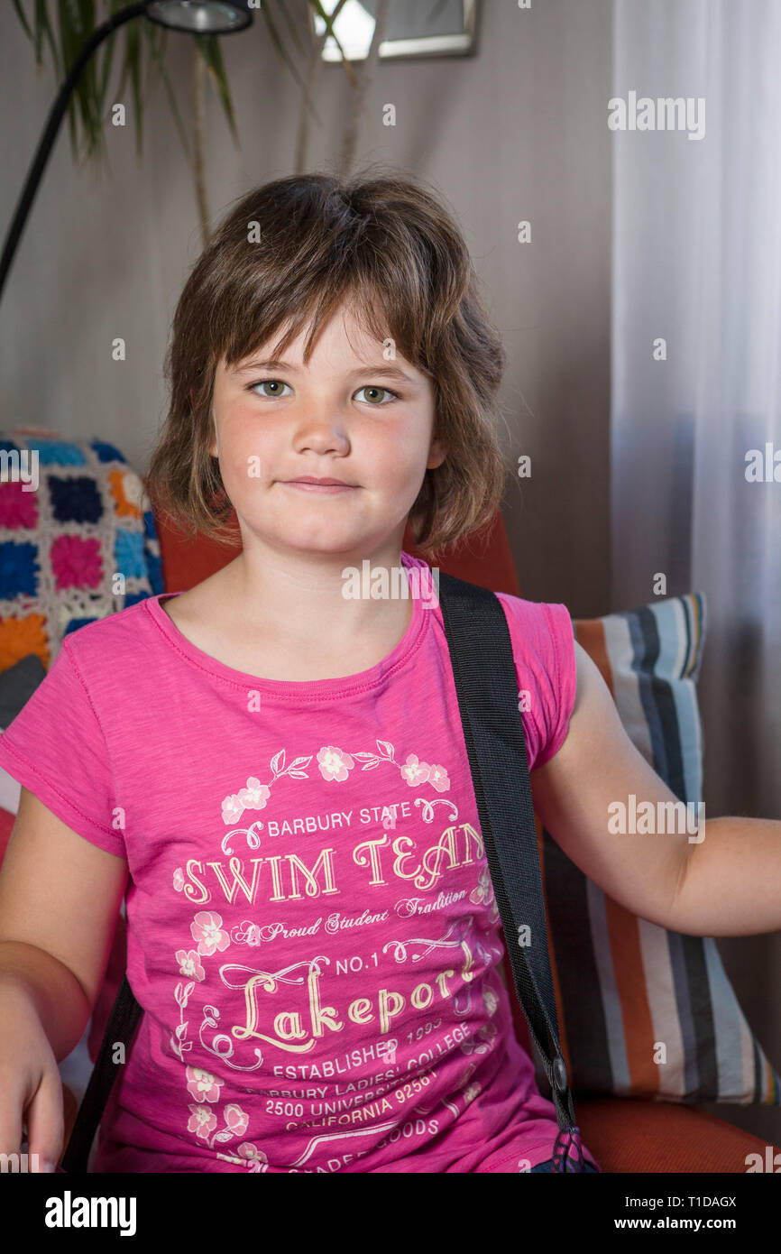 Portrait of a 7 year old girl at her first day in school Stock Photo ...