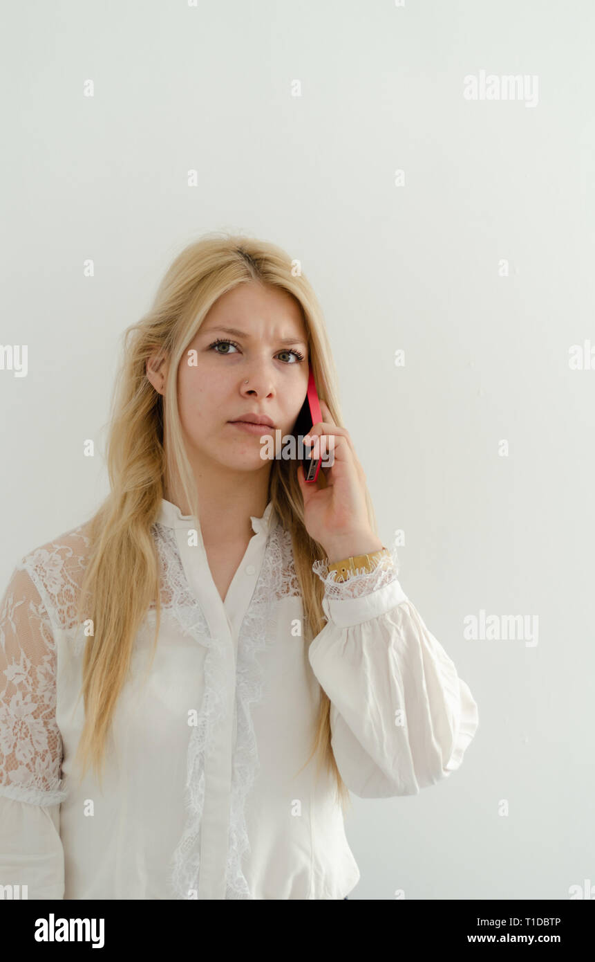 Emotional unhappy young glamorous female dressed in lace shirt , she is ...