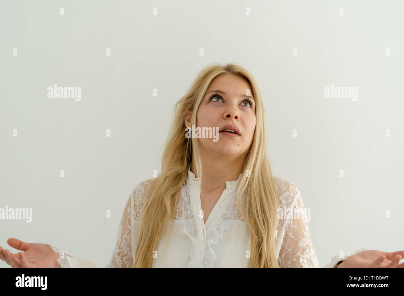 Who cares? So what? What can I do? Isolated studio shot of expressing ...