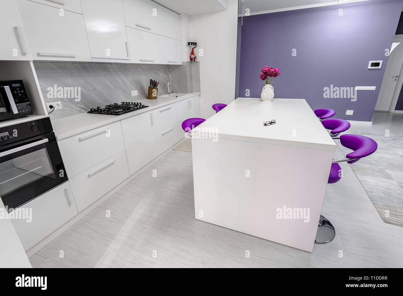 white dining table in modern kitchen Stock Photo - Alamy