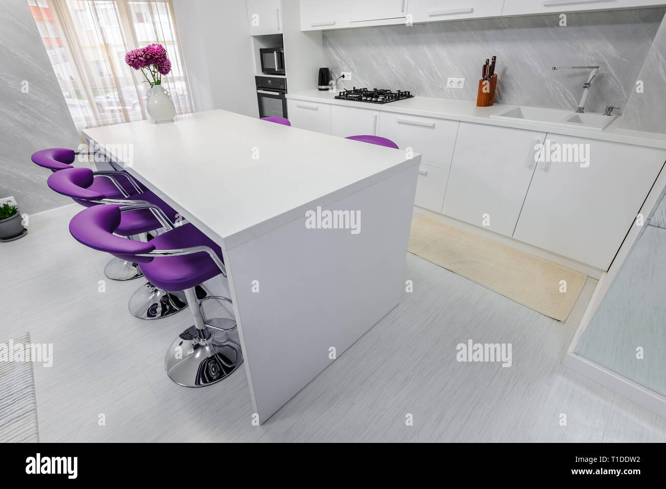 white dining table in modern kitchen Stock Photo - Alamy
