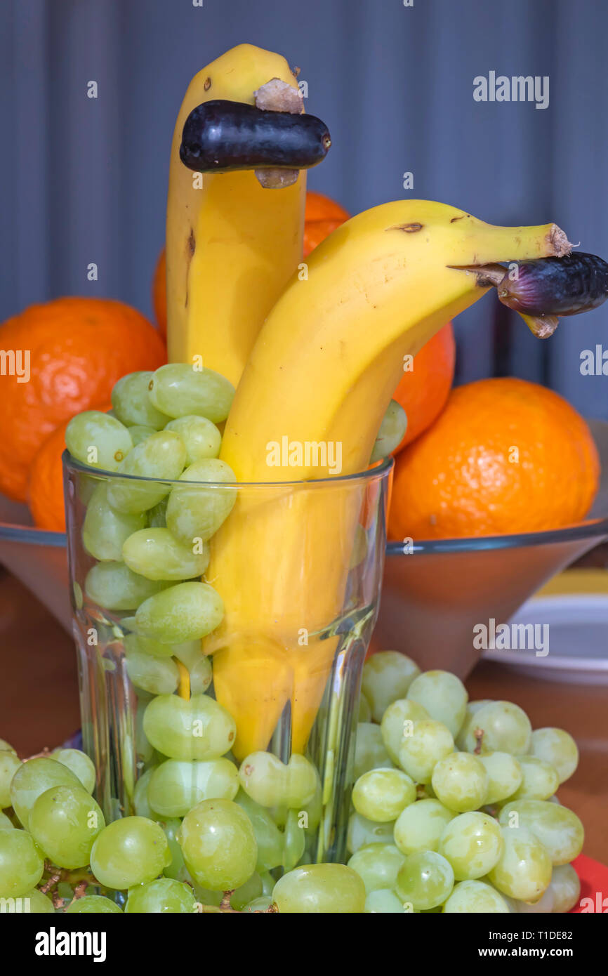 Fun food as a healthy snack with fruits: bananas as dolphins with a ...
