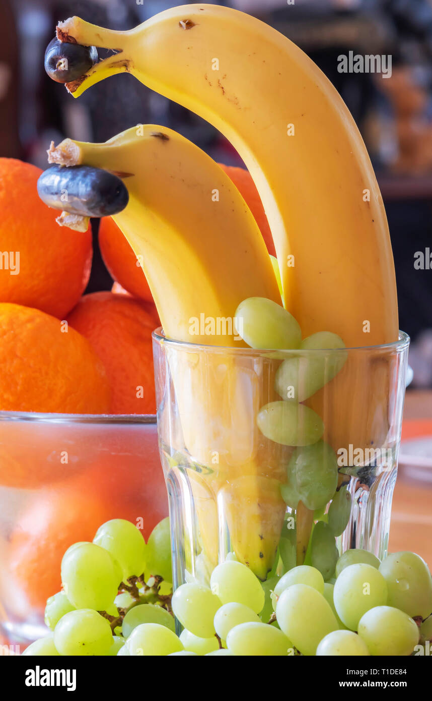 Fun food as a healthy snack with fruits: bananas as dolphins with a ...