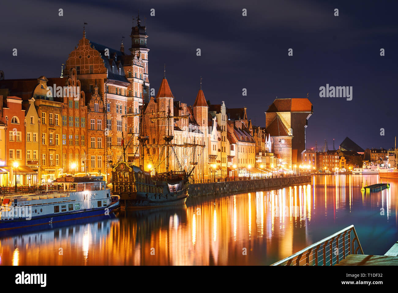 Night view of Gdansk harbor and Motlawa river, located in the Old Town ...