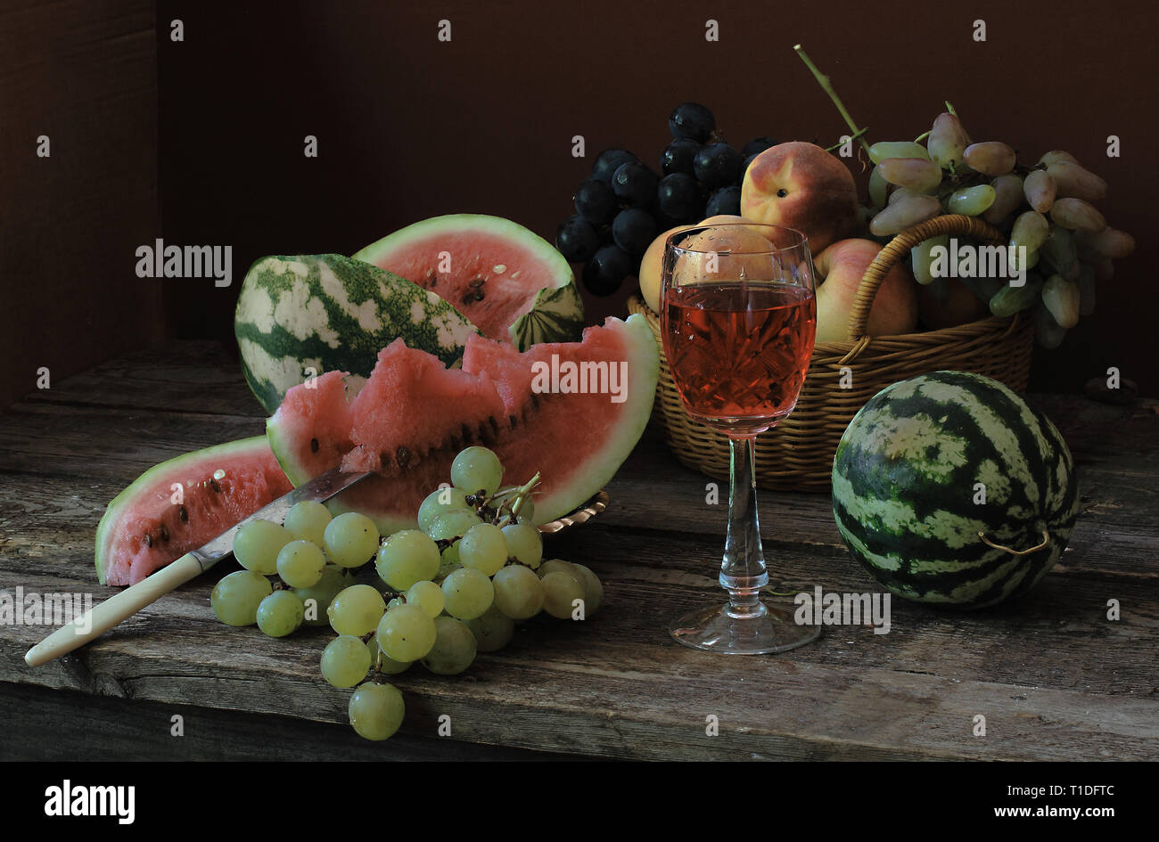 Still life with watermelon on a wooden table Stock Photo - Alamy