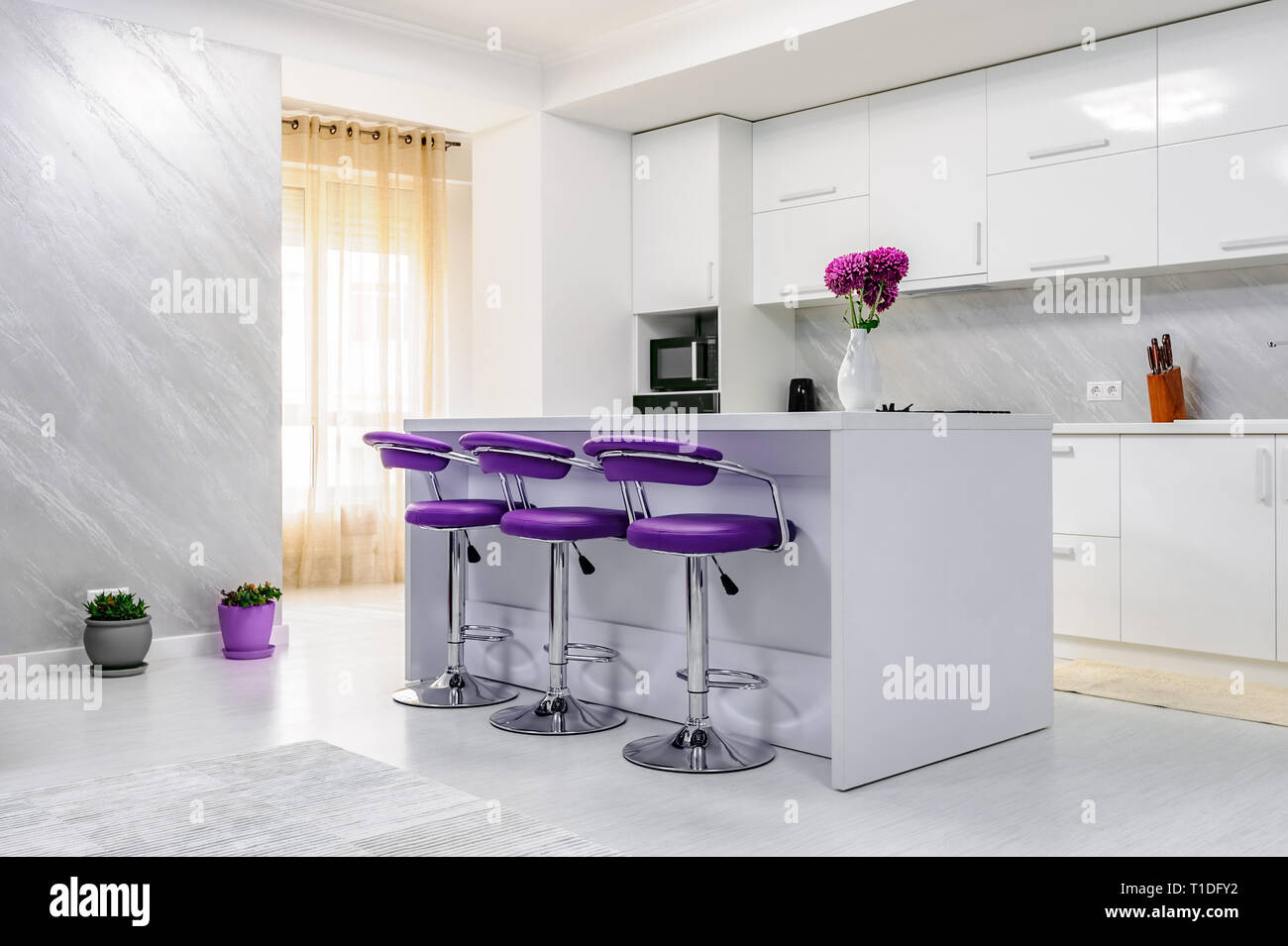 white dining table in modern kitchen Stock Photo - Alamy
