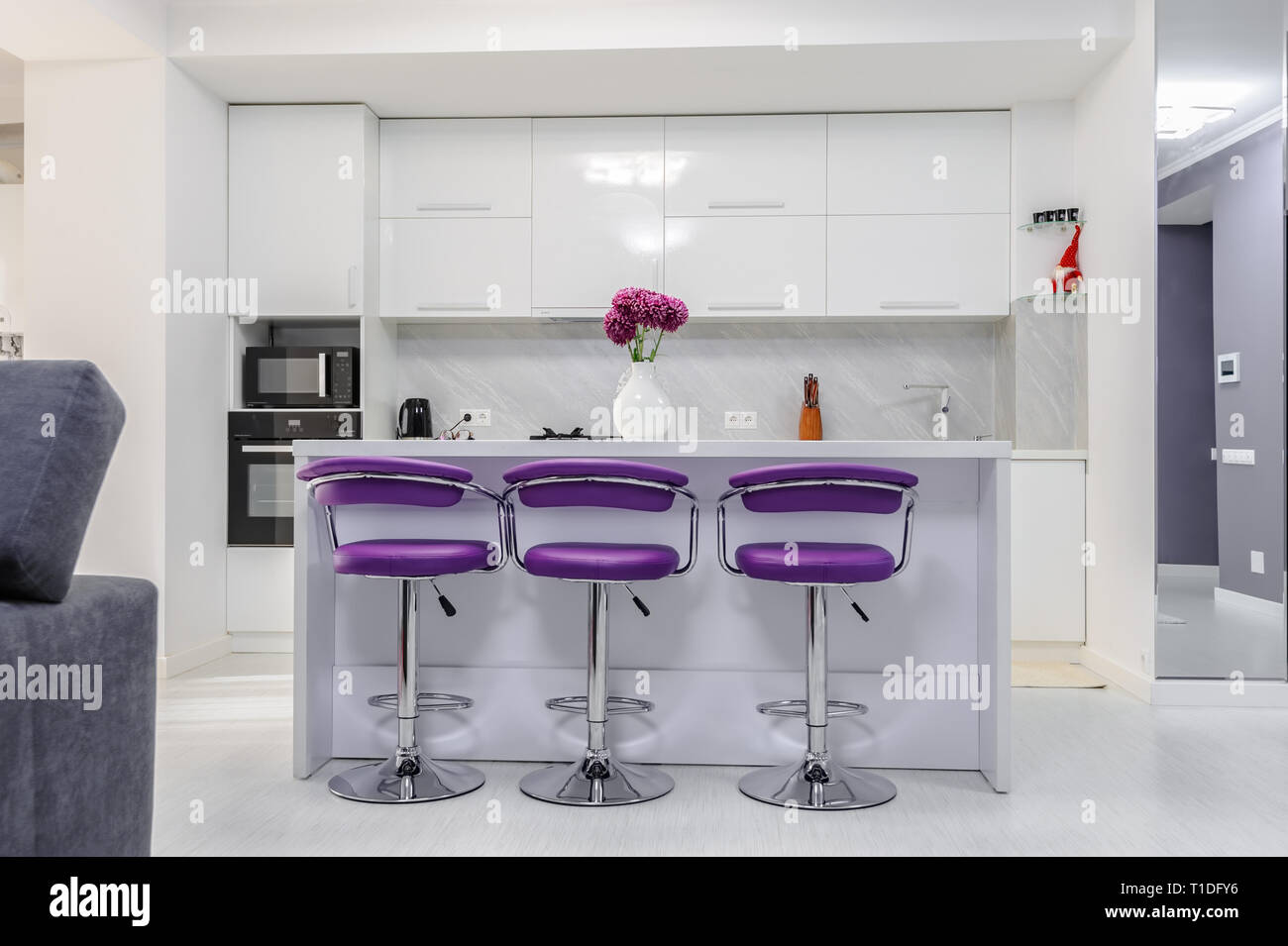 white dining table in modern kitchen Stock Photo - Alamy