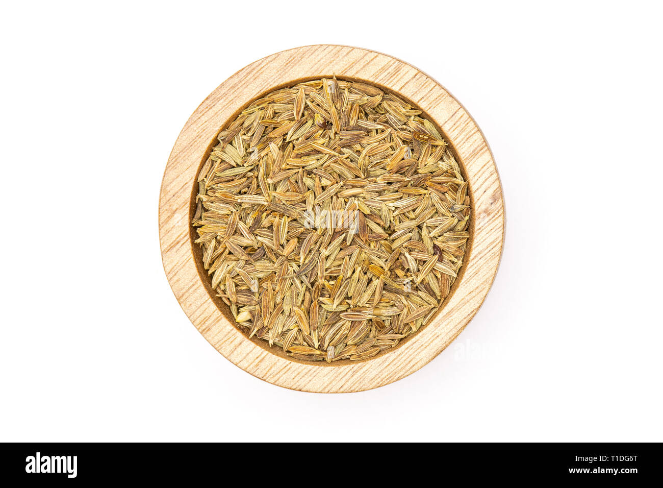 Lot of whole roman caraway seeds with wooden bowl flatlay isolated on ...