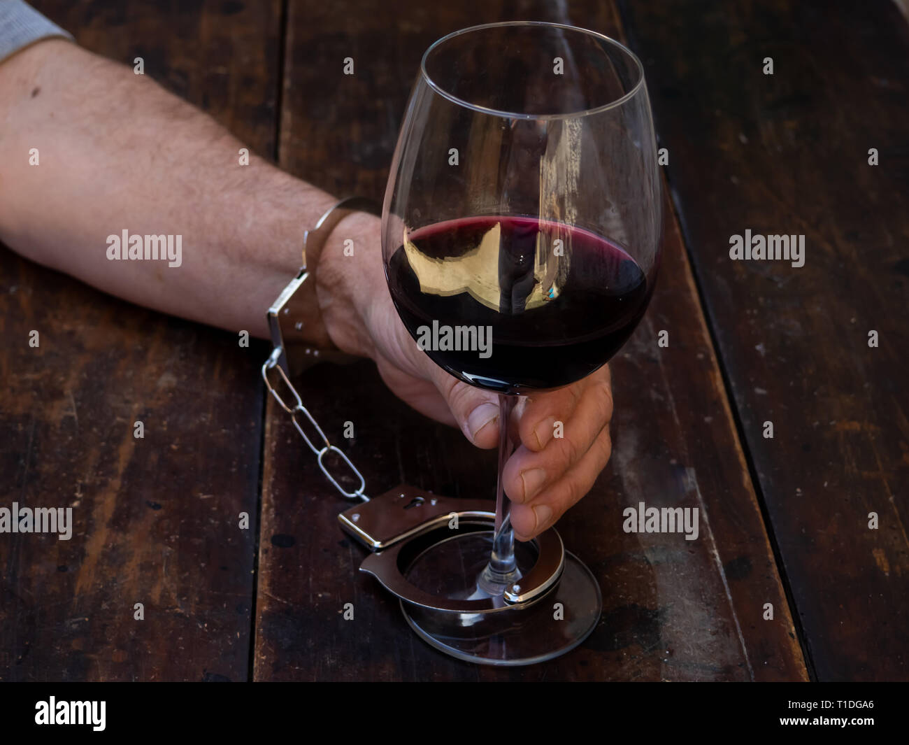 Handcuffs alcohol hi-res stock photography and images - Alamy