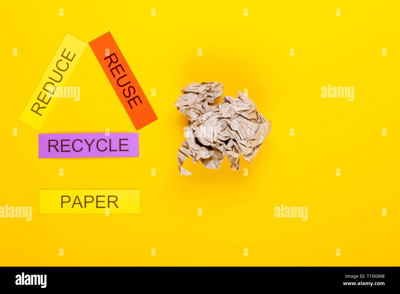 Recycling concept showing reduce, reuse & recycle with paper on a ...