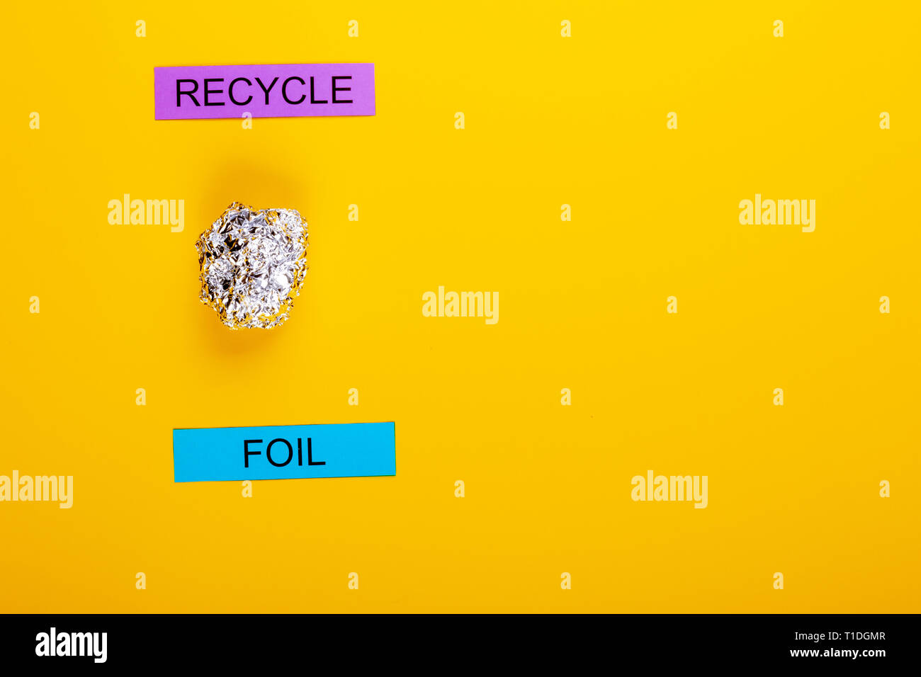 Recycling concept showing recycle & foil on a yellow background Stock ...