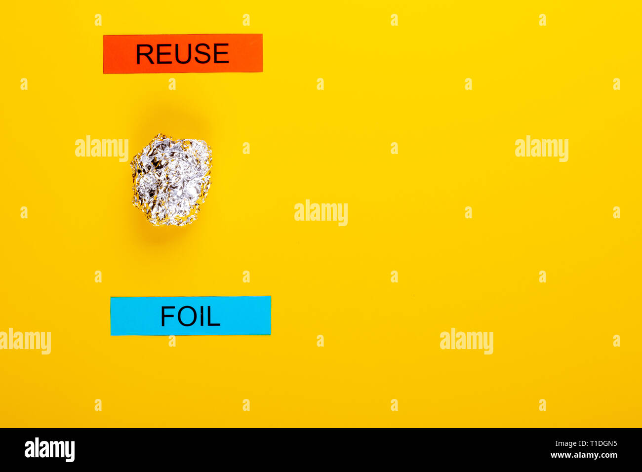 Recycling concept showing reuse & foil on a yellow background Stock ...
