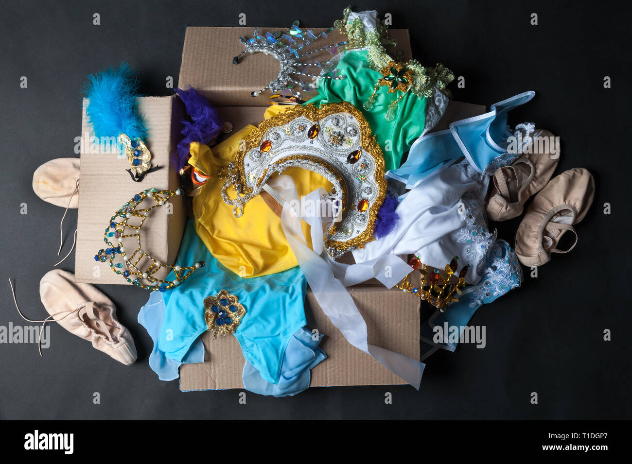 cardboard box with clothes for dancing on dark background Stock Photo ...