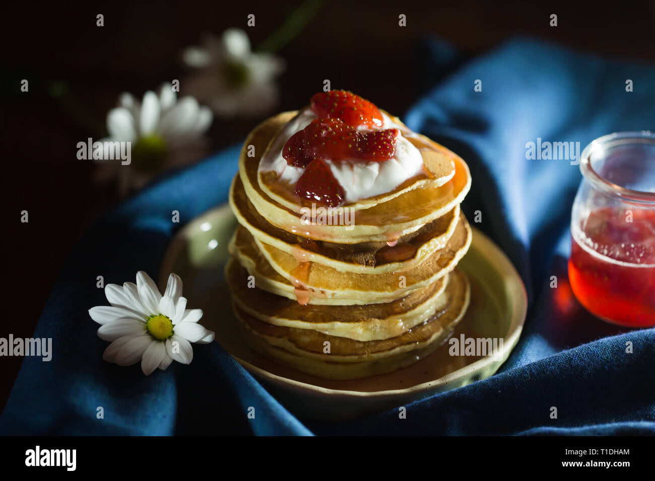 Pancakes with berries and yogurt on the dark background, horizontal ...