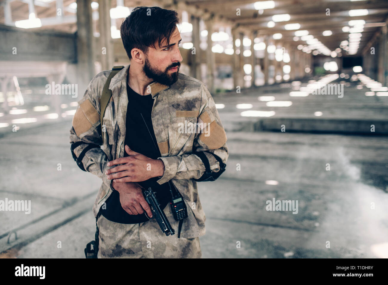 Careful and serious young man is looking to the right. He wears special ...