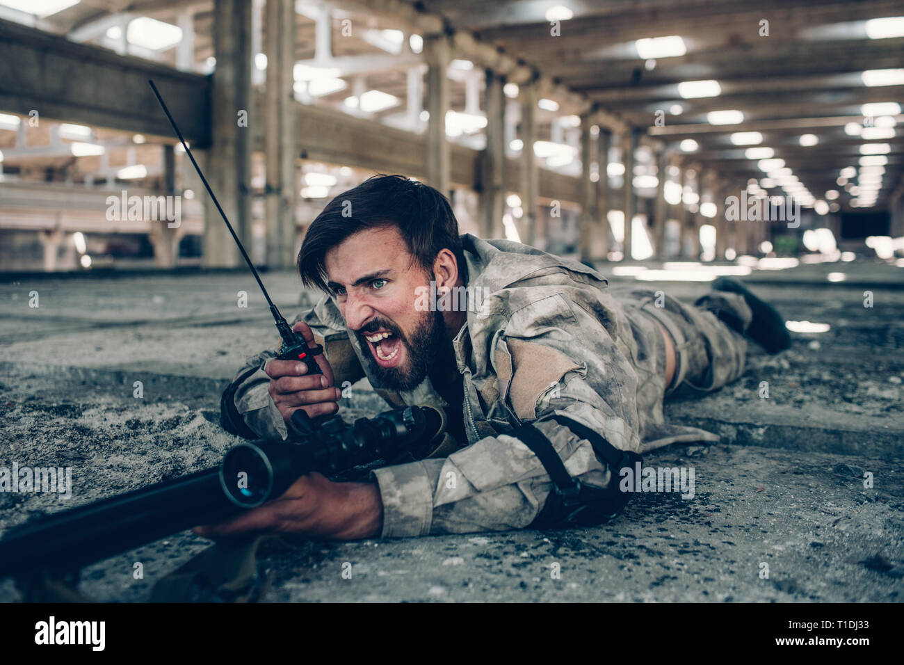 Soldier lying on ground gun hi-res stock photography and images - Alamy