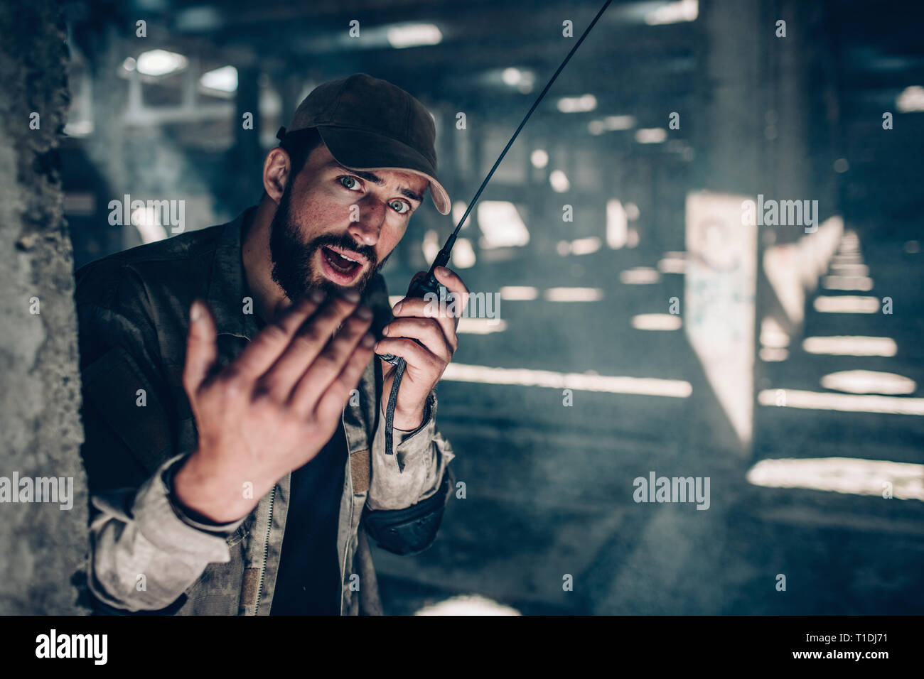 Man holding gun hiding behind hi-res stock photography and images - Alamy