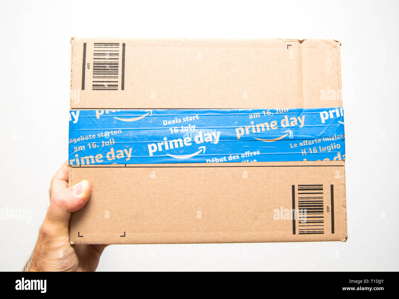 Paris, France - Jul 11, 2018: Man hand holding against white background ...