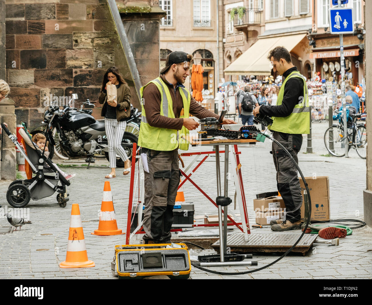Paris, France - June 13, 2018: Team working near open sewage manhole ...
