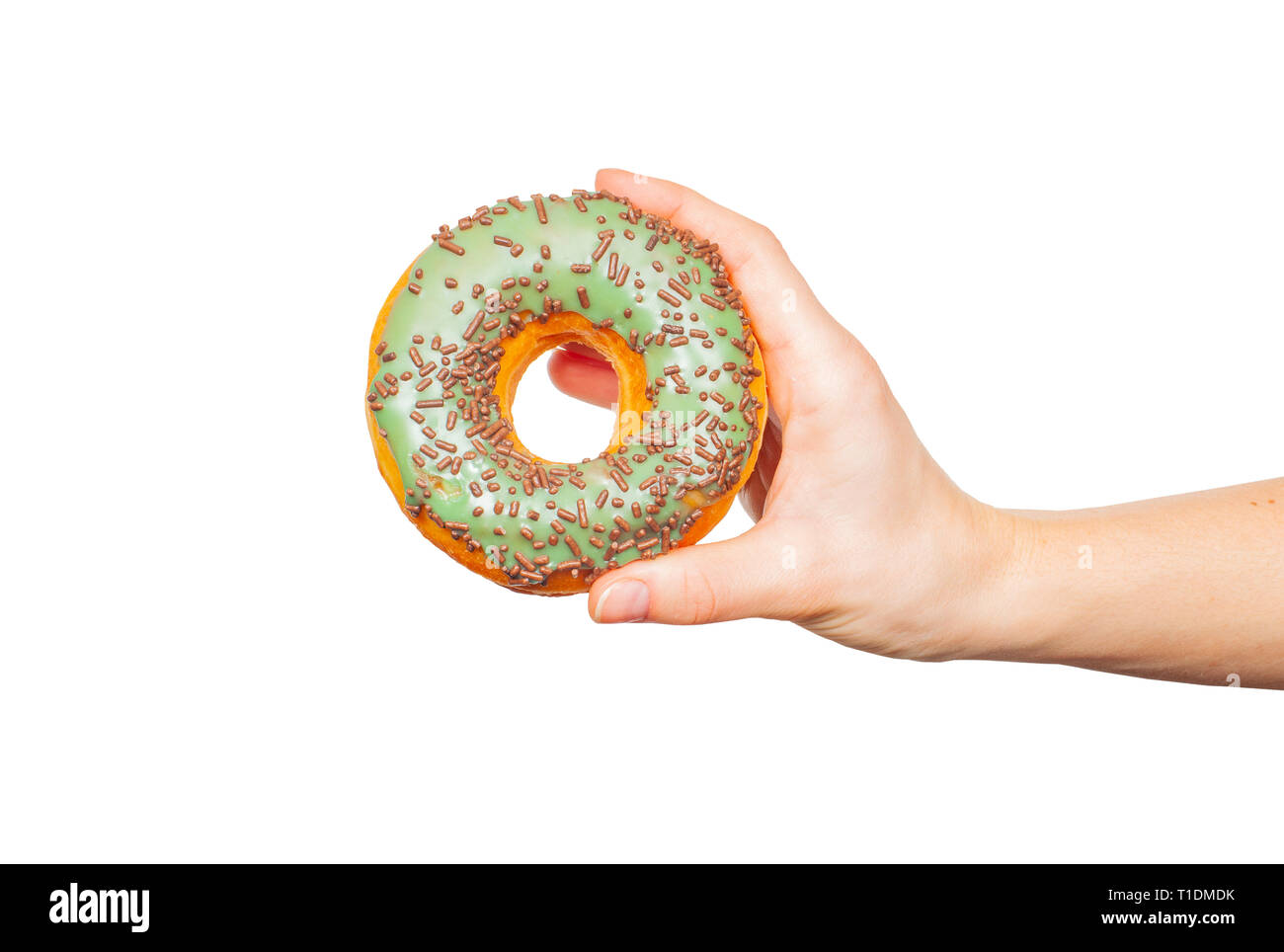 Female hand holding donut. Colorful donut on pastel white background ...