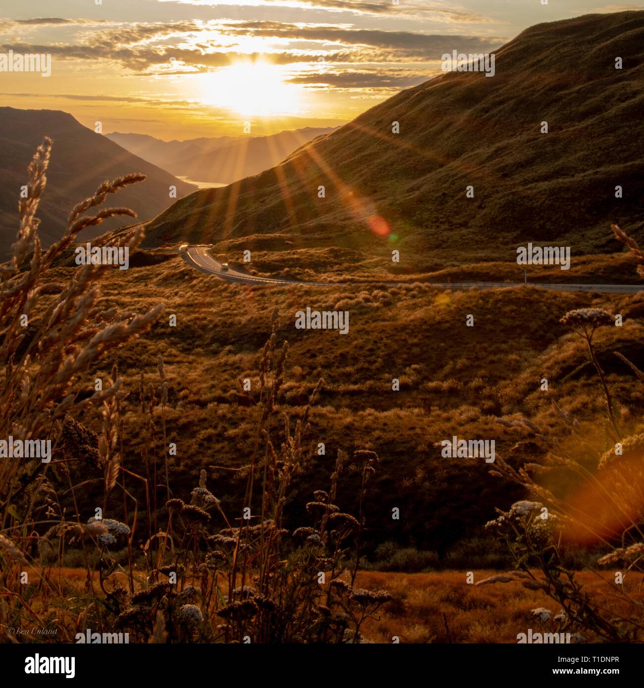 Overlooking Crown Range Road at sunset Stock Photo - Alamy
