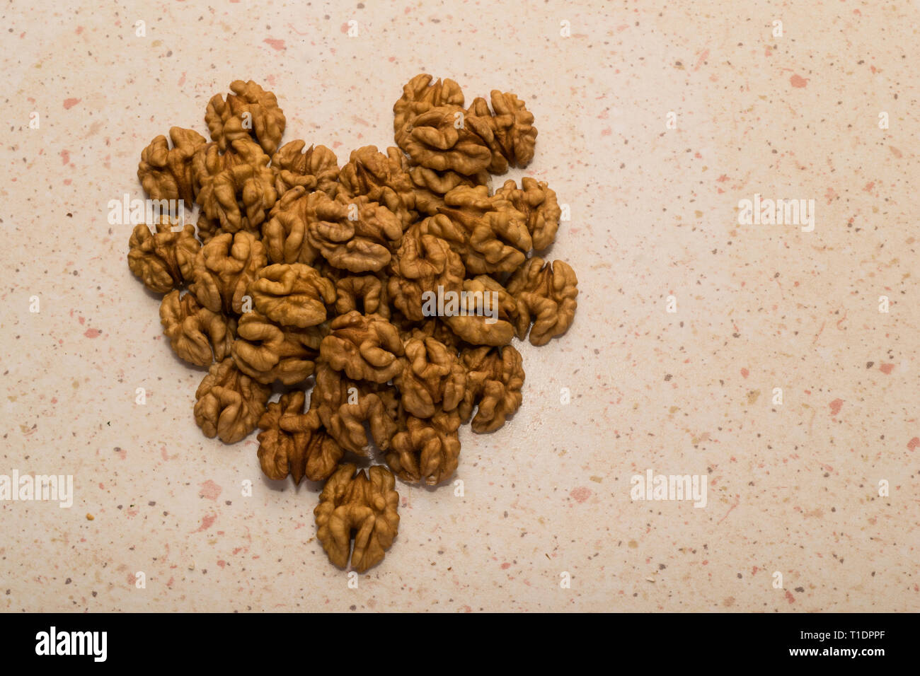 fresh cracked walnut seeds arranged in heart shape Stock Photo - Alamy