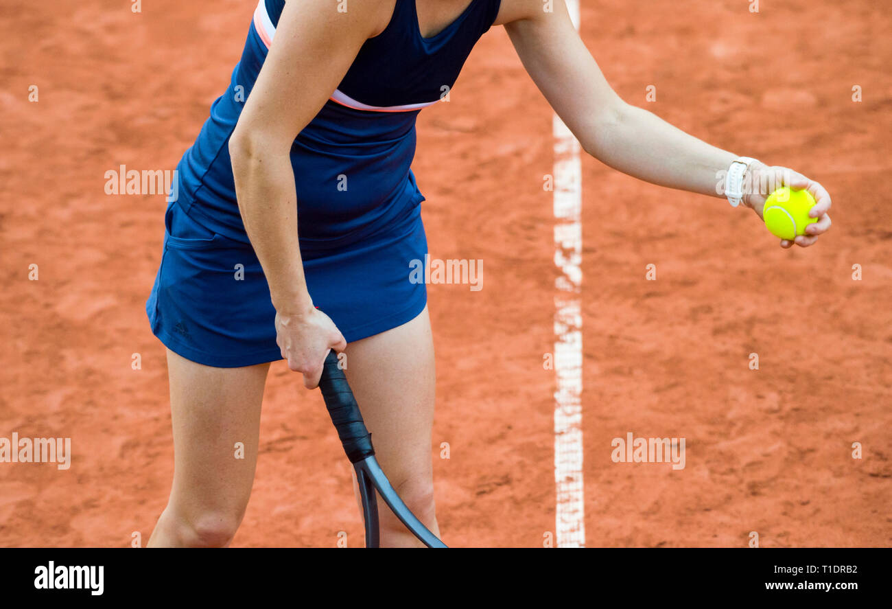 Tennis player holding racket and ball in hands Stock Photo - Alamy