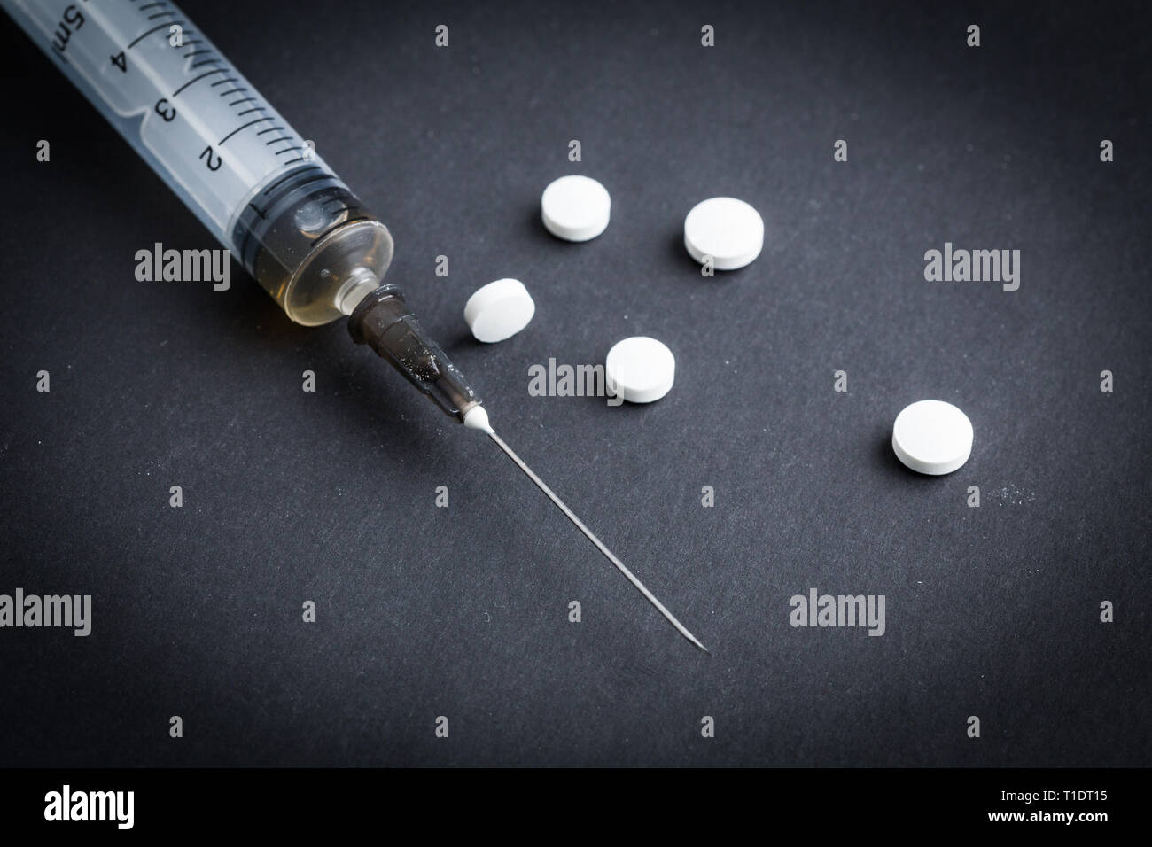 Still life drugs and syringe on table Stock Photo - Alamy