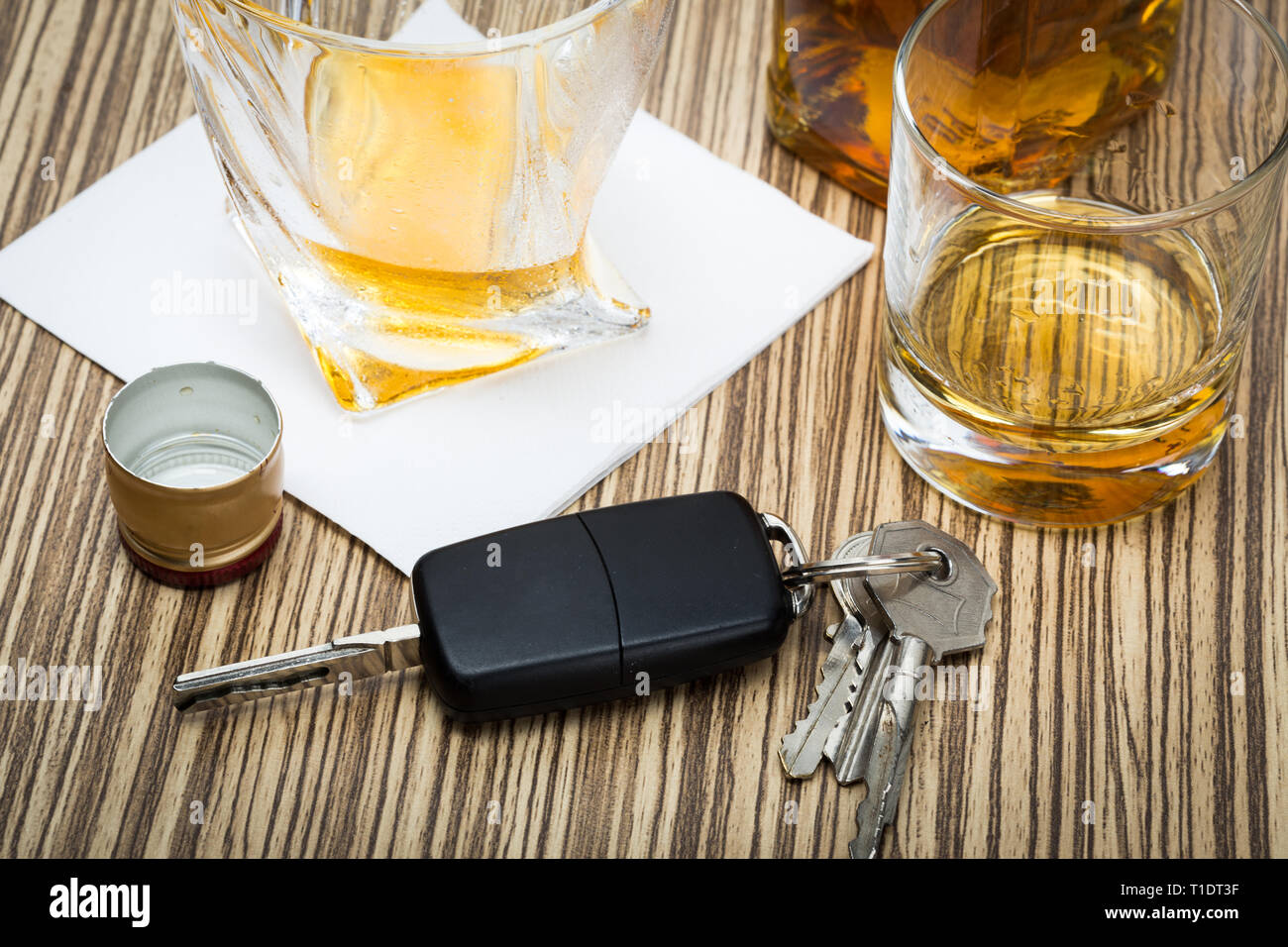 Car key on the bar with spilled alcohol Stock Photo - Alamy
